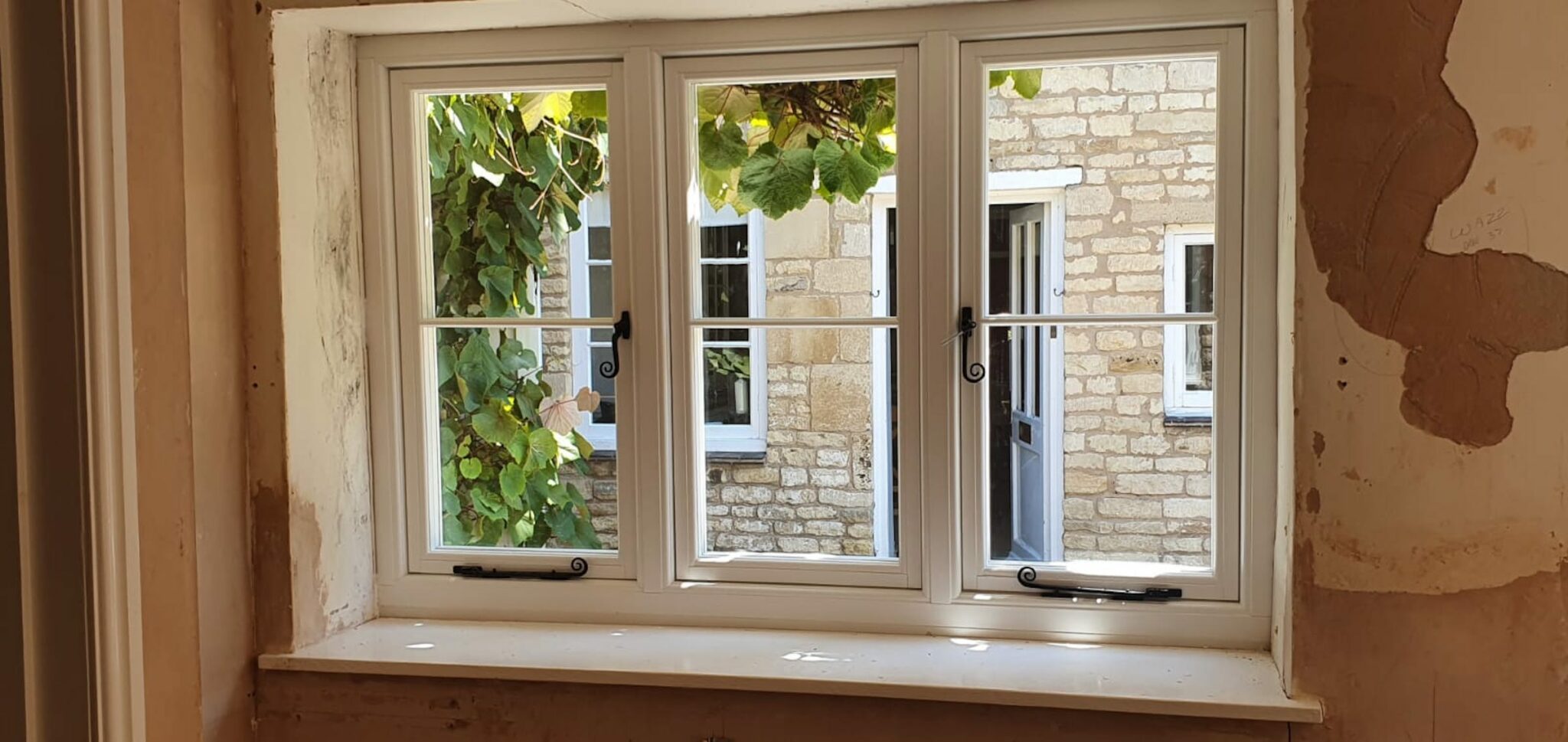 White timber look windows in Rutland - aluhomes LImited
